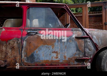 Fire damaged classic Mini car Stock Photo - Alamy