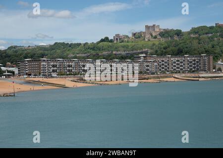 Dover sea front beach and promenade with castle above. Kent England ...