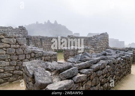 Empty granite stone building structures at Machu Picchu in Peru Stock ...
