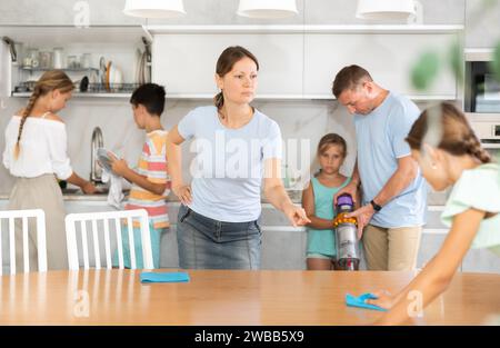 Big family members cleaning their house Stock Photo - Alamy
