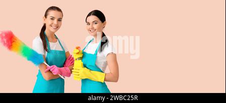 Female janitors on beige background with space for text Stock Photo - Alamy