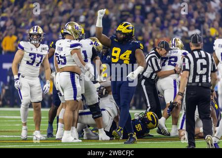 Michigan defensive lineman Kris Jenkins runs the 40-yard dash at the ...