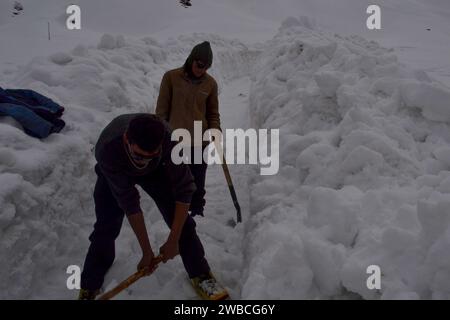 Snow-covered Kedarnath temple route in Himalaya. Kedarnath is a town in ...