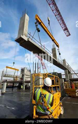 Crane lifting pre cast concrete panels on a UK construction site Stock ...