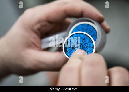 Stuttgart, Germany. 10th Jan, 2024. An employee of the testing ...