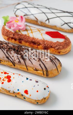 Beautiful delicious french eclairs set with original cream decor on ...