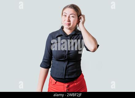 Confused girl scratching her head isolated. Worried woman scratching ...