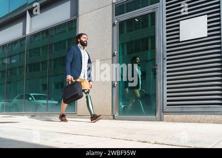 Photo with copy space of a businessman with prosthetic leg walking ...