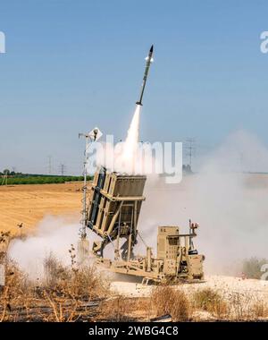 The Israeli Iron Dome air defense system fires to intercept missiles over Tel Aviv, Israel ...