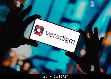 In this photo illustration, the Veradigm logo is displayed on a ...