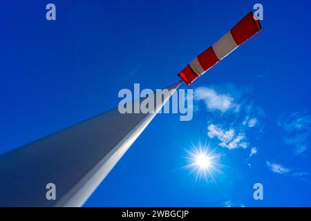 windsock in operation with strong blue sky background with sun Stock ...