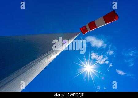 windsock in operation with strong blue sky background with sun Stock ...