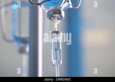 IV drip chamber against blurred yellow background Stock Photo - Alamy
