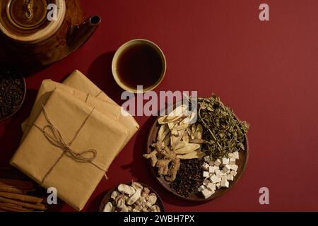 A bowl of tonic and herbal medicine packs are decorated with various ...