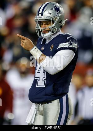 The Dallas Cowboys huddle on the field before an NFL football game ...