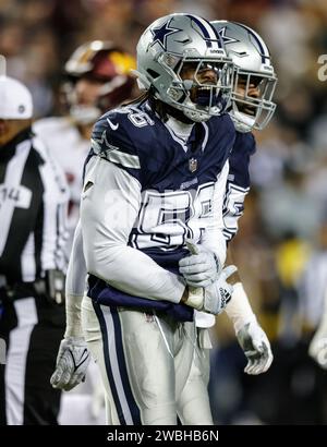 Dallas Cowboys defensive end Dante Fowler Jr. takes a drink during ...