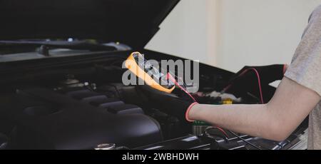 Auto mechanic Check batteries, repair, and replace engine parts Stock ...