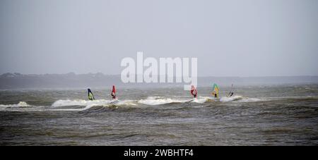 Windsurfers enjoying gale force winds and waves Stock Photo - Alamy