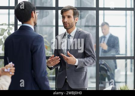 Successful team of young perspective businesspeople in office Stock ...