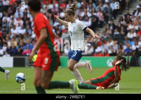 Niamh Charles rides a tackle during England Lionesses women's football ...