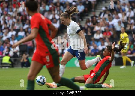 Niamh Charles rides a tackle during England Lionesses women's football ...