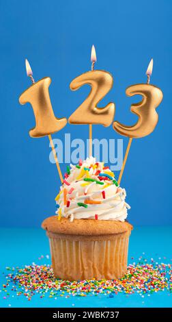 Candle number 123 - Cake birthday in blue background Stock Photo - Alamy