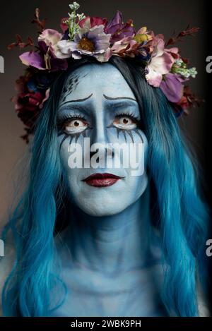 Masked woman, made up for Halloween, reminiscent of the animated film ...