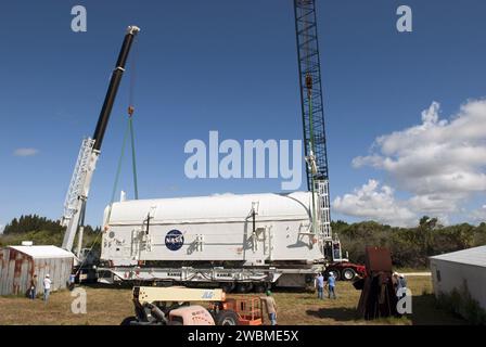 CAPE CANAVERAL, Fla. – Cranes are attached to the first of the Ares I-X ...