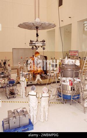 Workers in the Space Assembly and Encapsulation Building 2 prepare the ...