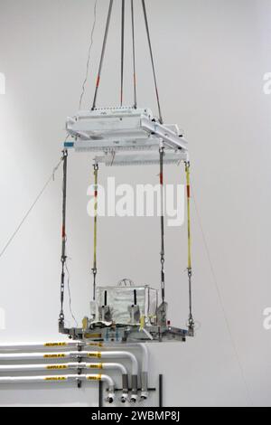 CAPE CANAVERAL, Fla. – A crane lifts a segment for a set of twin, full ...