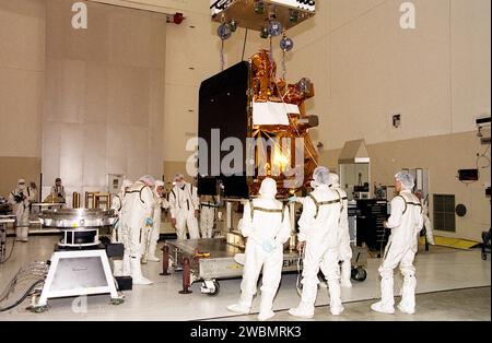 An overhead crane moves The Gamma Ray Spectrometer (GRS) into place to ...