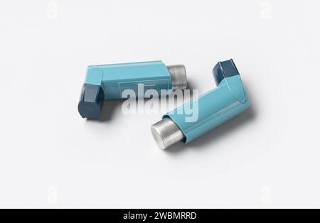 Asthma inhalers on grey background Stock Photo - Alamy