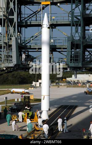 At Cape Canaveral, workers prepared a solid rocket booster for mating ...