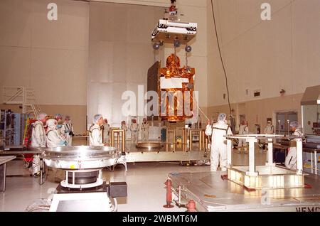 Workers in the Space Assembly and Encapsulation Building 2 prepare the ...