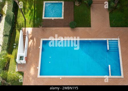Swimming Pool viewed from above. Top down view of modern luxury villa ...
