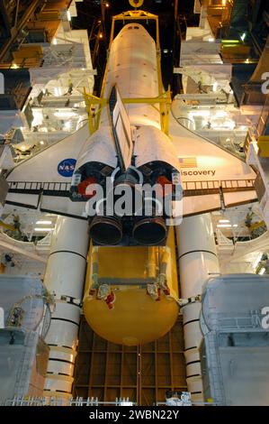 KENNEDY SPACE CENTER, FLA. - Suspended from an overhead crane, the ...