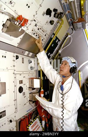 NASA STS-47 Spacelab-J mission astronaut Mae Jemison has her spacesuit ...