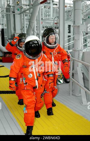 At the 195-foot level of the Fixed Service Structure, the STS-98 crew watches a slidewire basket ...