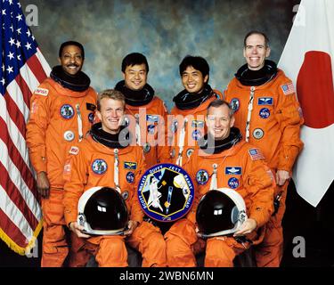 Space shuttle Endeavour commander Scott Kelly waves as he walks along ...