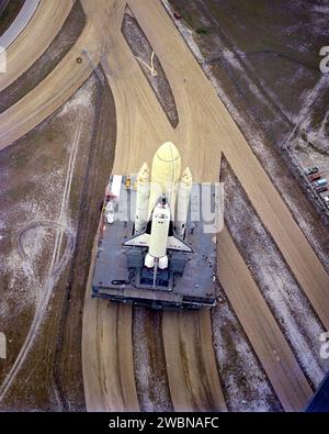 STS-1 Columbia, with external tank and twin solid rocket boosters, is ...
