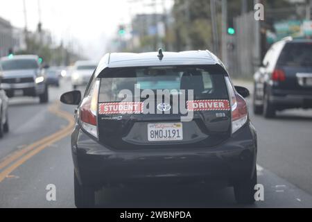 Student driver (learner driver) sign on top of driver training car ...