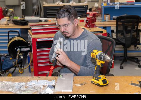 Matthew Sanchez assembles wing ribs to the 10-foot model of the ...