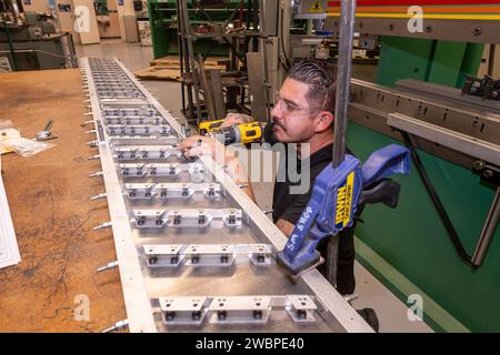 Matthew Sanchez assembles wing ribs for a 10-foot model of the ...