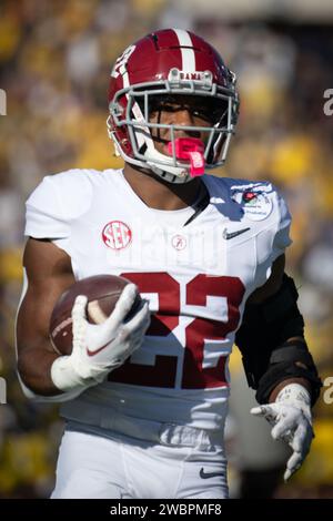 Michigan running back Justice Haynes, right, greets Jasper Parker on ...