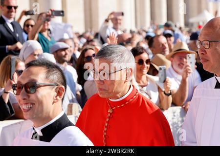 Cardinal Stephen Chow Sau-yan is approached by reporters as he arrives ...