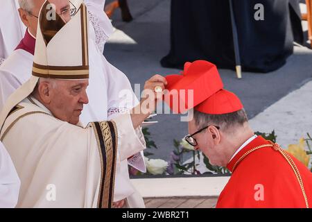 Pope Francis puts the red biretta on the head of new cardinal Agostino ...