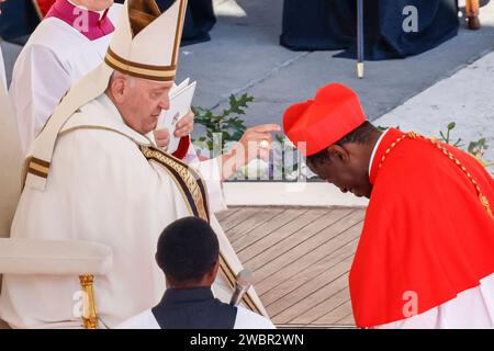 Pope Francis puts the red biretta greets new cardinal Diego Rafael ...