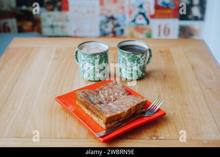 Kopitiam breakfast menu set contains a toast and two cup of coffee with ...