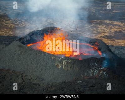 Unique view of the erupted volcano and surroundings, boiling red hot ...