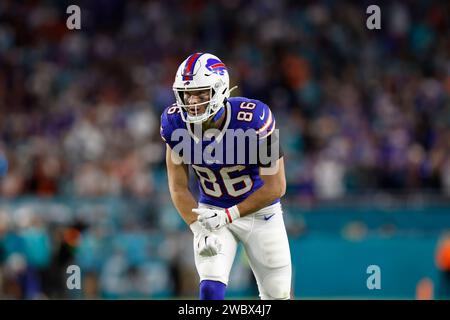 Buffalo Bills tight end Dalton Kincaid, right, waves as he walks with ...